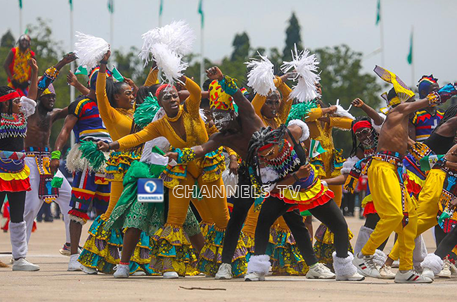 Members of a cultural troupe in a display during the ceremony to mark ...