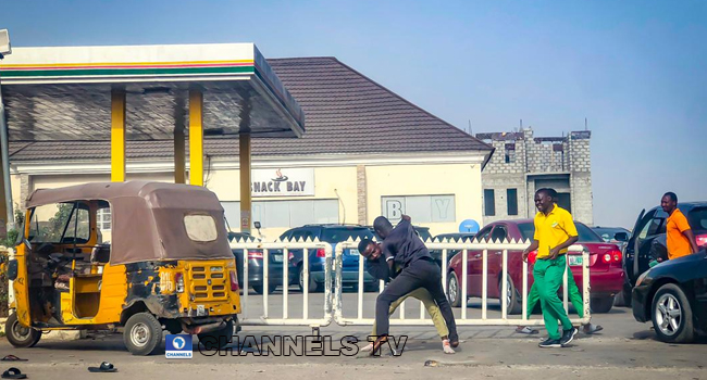 PHOTOS: Tricyclist, Motorist Exchange Blows Amid Fuel Scarcity In Abuja • Channels Television